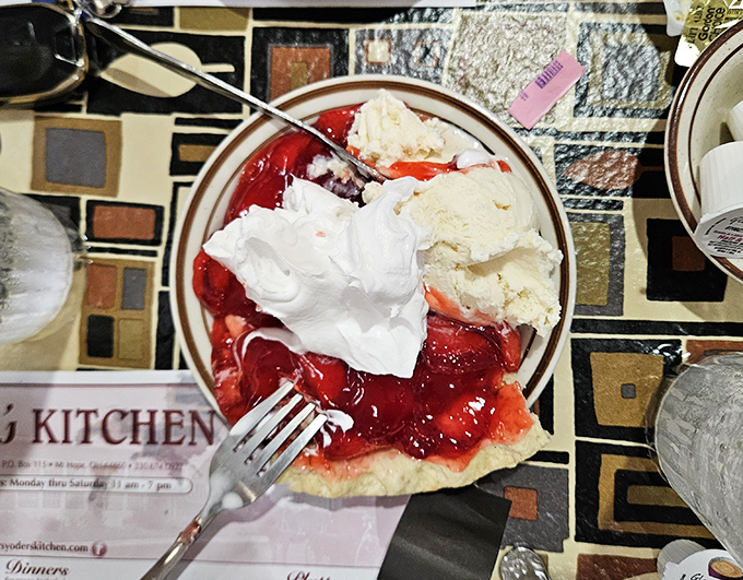 A slice of strawberry pie that makes you understand why people write songs about dessert. That whipped cream mountain isn't just for show.