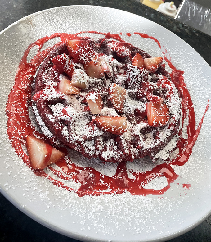 Strawberry waffles get the horror-movie treatment with blood-red drizzle that's actually delicious berry sauce.