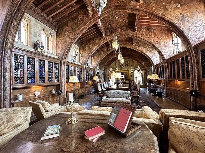 The Gothic Study looks like where Hemingway might write if he suddenly inherited a kingdom. Those ceiling arches have heard more fascinating conversations than any therapist in Beverly Hills.