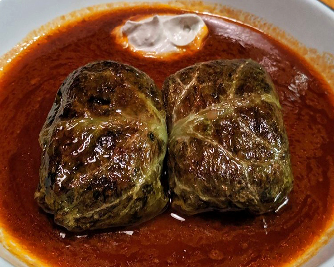 Stuffed cabbage rolls bathing in rich tomato sauce&mdash;like Eastern European comfort wrapped in a leafy green hug that warms you from the inside out.
