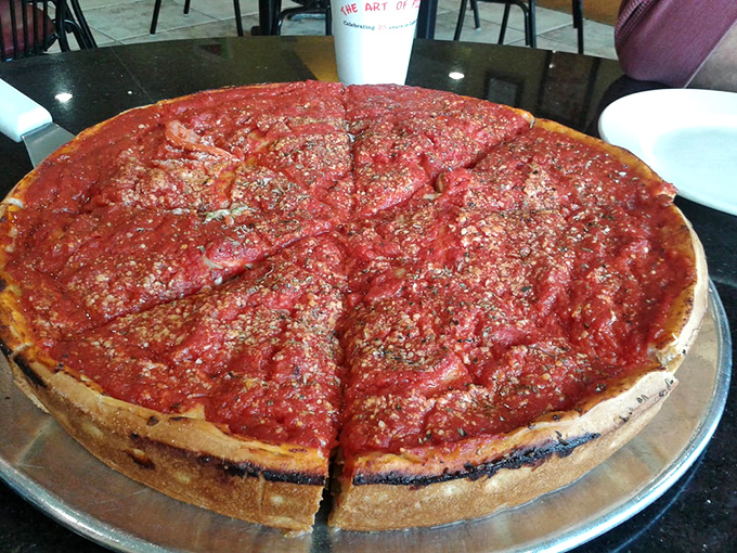Chicago-style deep dish in all its glory &ndash; that magnificent wall of crust containing a lake of bright tomato sauce that demands both fork and respect.