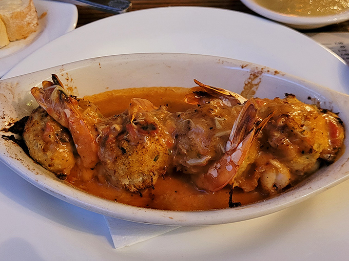 Jumbo shrimp nestled in a rich, savory sauce&mdash;proof that sometimes the most memorable seafood comes not from the ocean, but from a well-loved kitchen.