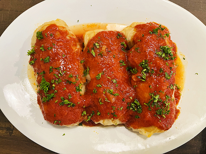 Behold the stuffed cabbage in all its saucy glory! These bundles of joy are what comfort food dreams are made of.