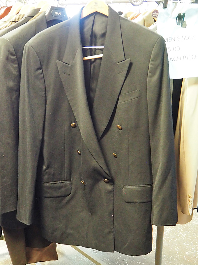 Sharp suits hanging like they're auditioning for a Mad Men revival episode.