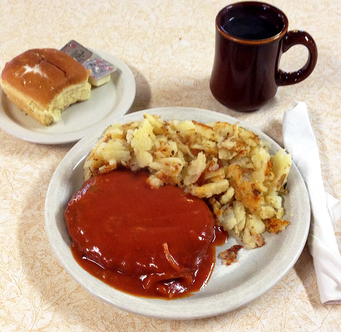 Swiss steak and hash browns &ndash; the kind of plate that makes you want to cancel your afternoon plans in favor of a well-deserved food nap.