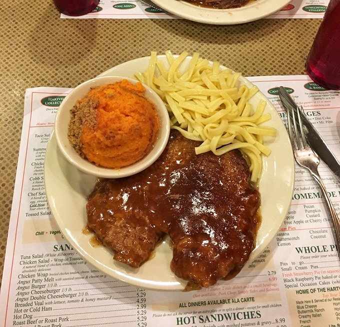Swiss steak so tender it surrenders to your fork without putting up a fight.
