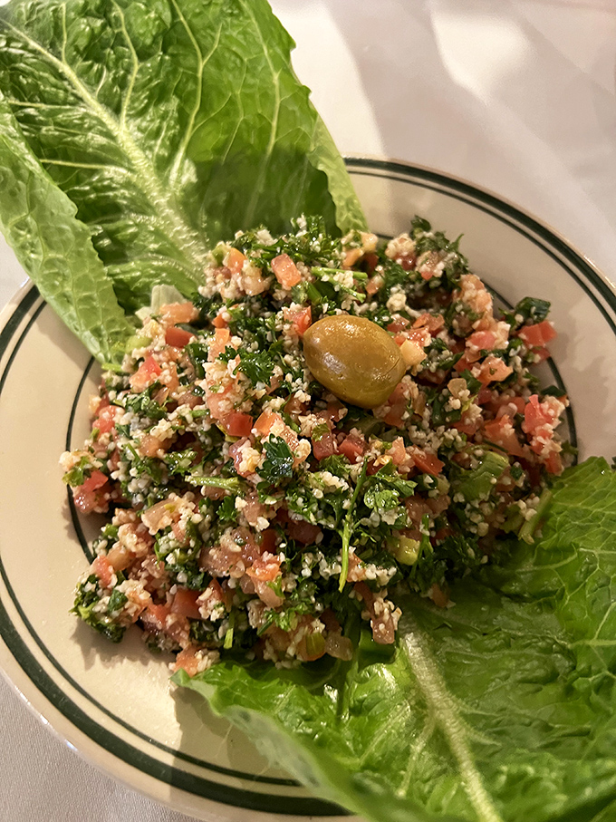 This tabbouleh salad isn't just fresh – it's performing photosynthesis on your plate, with parsley and tomatoes playing the starring roles.
