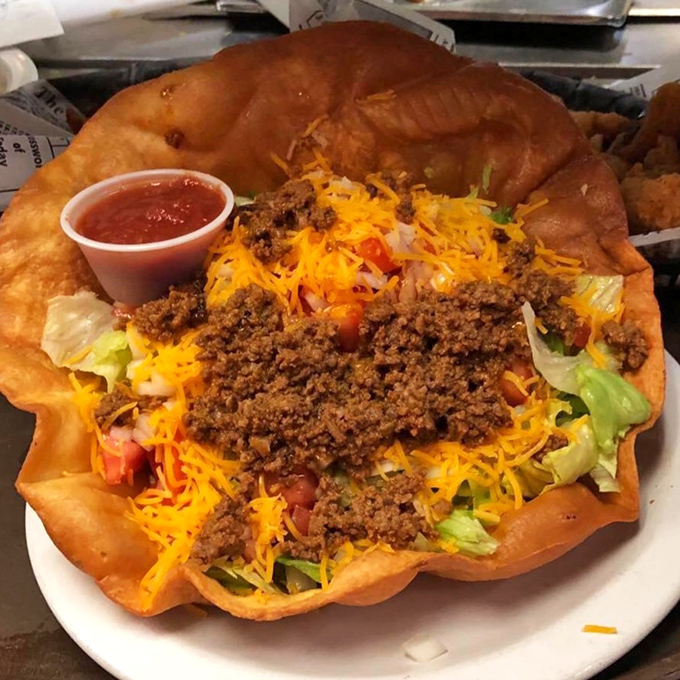 A taco salad that defies gravity and logic. The fried tortilla bowl is essentially an edible trophy filled with delicious victory.