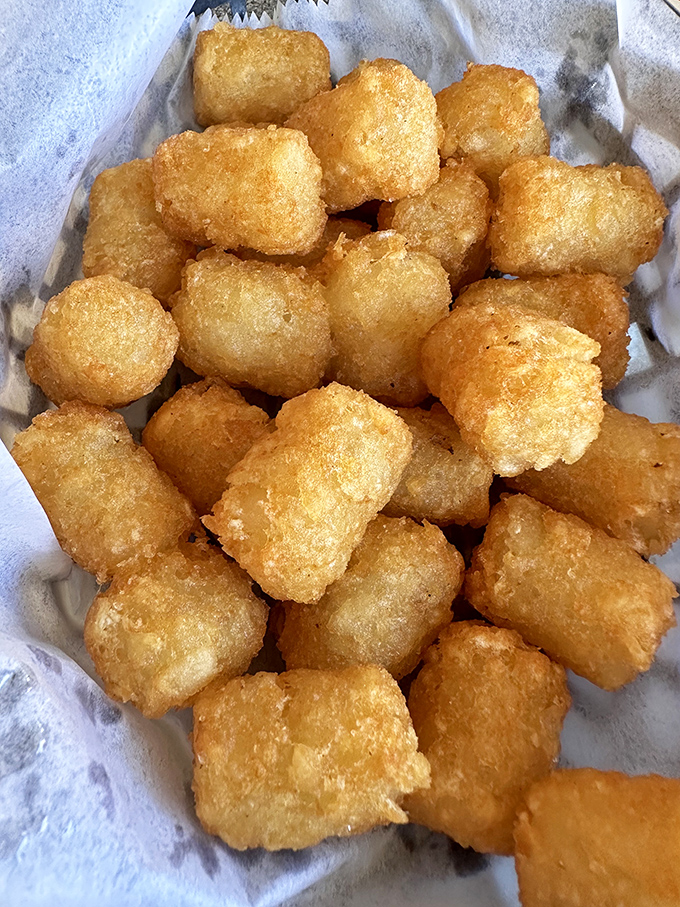 Golden tater tots that crunch like childhood memories. These crispy potato pillows are what french fries dream of becoming.