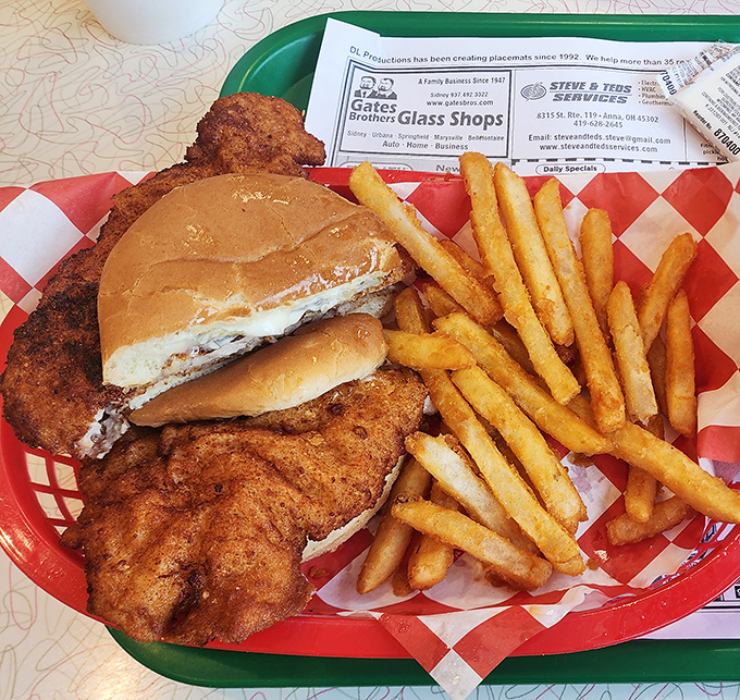 The tenderloin sandwich that launched a thousand cravings, served with golden fries that crackle with each bite.