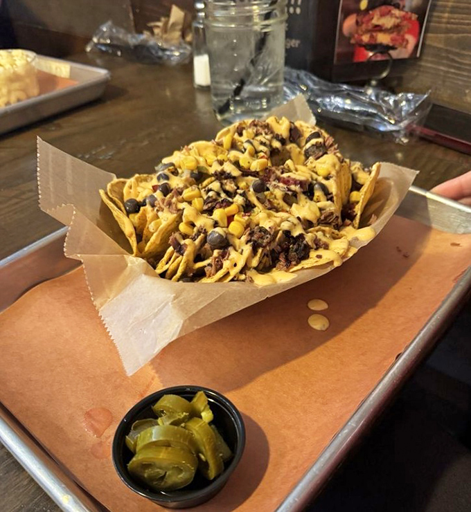 These loaded nachos arrive looking like edible architecture &ndash; Frank Lloyd Wright would approve of this delicious chaos.
