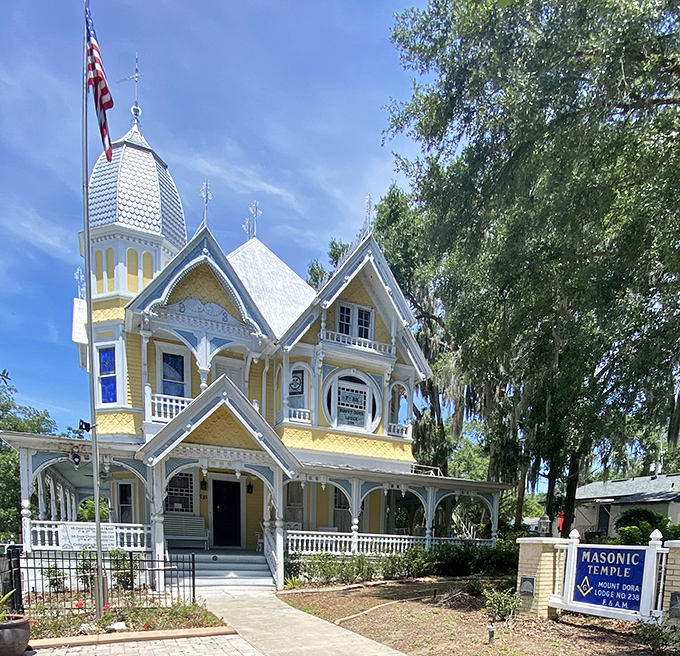 The yellow Victorian Masonic Temple stands as a cheerful reminder of Mount Dora's architectural heritage, looking like it was plucked straight from a Wes Anderson film.