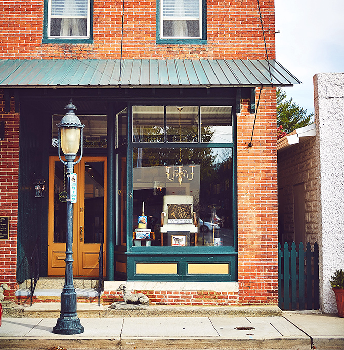 The Greyhound Bookstore's vintage brick facade and classic lamppost create the perfect setting for literary discoveries. Bibliophiles, you've found your happy place.