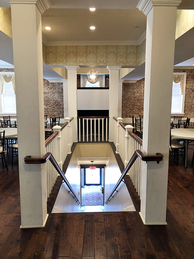 Grand staircases and exposed brick walls&mdash;this beautifully restored interior space whispers tales of Sandersville's past while welcoming visitors into its present.