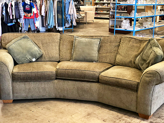 This curved sectional sofa isn't just comfortable&mdash;it's practically begging for a Netflix marathon and the inevitable nap that follows. Gently used comfort at its finest.