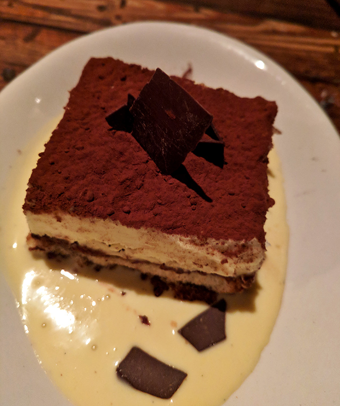 Tiramisu that would make an Italian nonna weep with joy. The perfect ratio of coffee-soaked ladyfingers to mascarpone cream creates dessert nirvana.