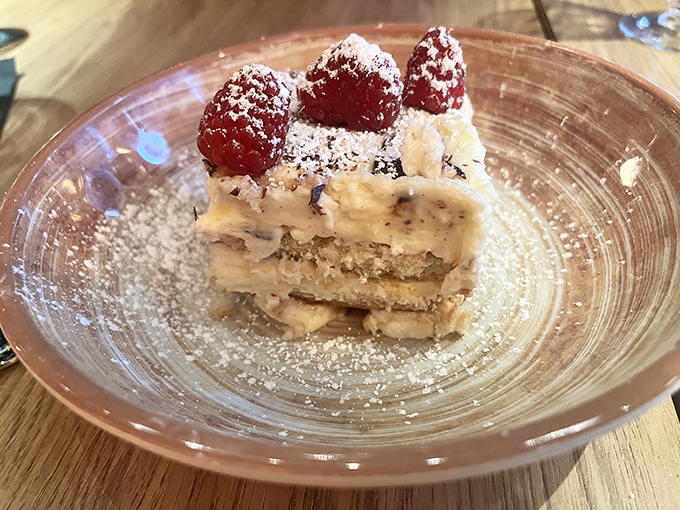 This tiramisu looks like it could solve world peace, one heavenly spoonful at a time.