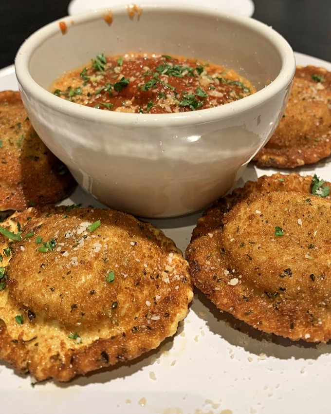 These aren't your average toasted ravioli. Crispy, golden pillows surrounding a savory filling, served with a dipping sauce that demands you order seconds.