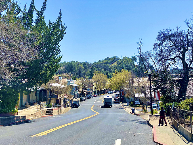 The gentle curve of Main Street reveals Angels Camp's thoughtful preservation, where modern necessities blend seamlessly with 19th-century charm.
