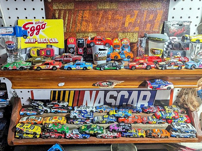 NASCAR miniatures lined up like colorful soldiers, waiting to race from a vendor's display straight into a collector's heart.