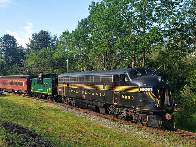 Dressed in classic Pennsylvania Railroad livery, this magnificent diesel locomotive stands ready to transport passengers not just across miles, but across decades of American history.