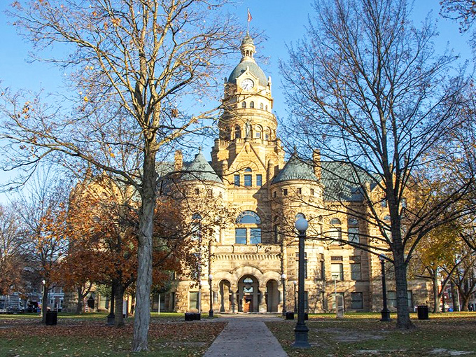 The Trumbull County Courthouse commands attention with its sandstone grandeur, like a Victorian gentleman who refuses to be ignored.