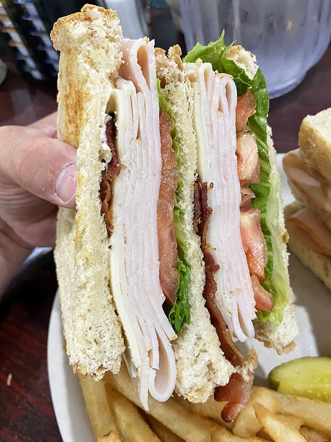 Layer upon layer of thinly sliced turkey, crisp bacon, and fresh veggies create the turkey club sandwich equivalent of a well-orchestrated symphony. Beethoven would approve.