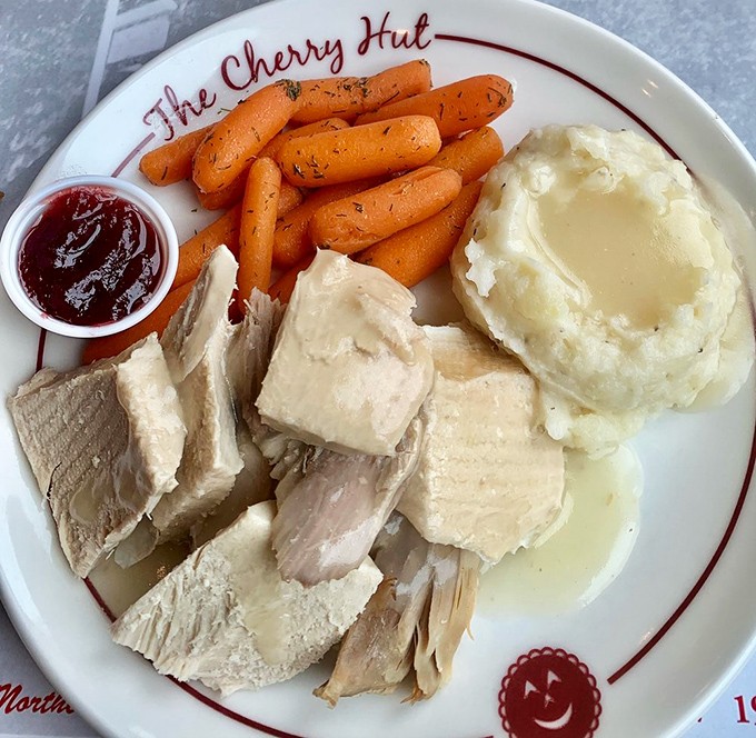 Turkey dinner with all the fixings and that signature cherry sauce&mdash;comfort food that makes you want to call your mother and apologize for liking this better.