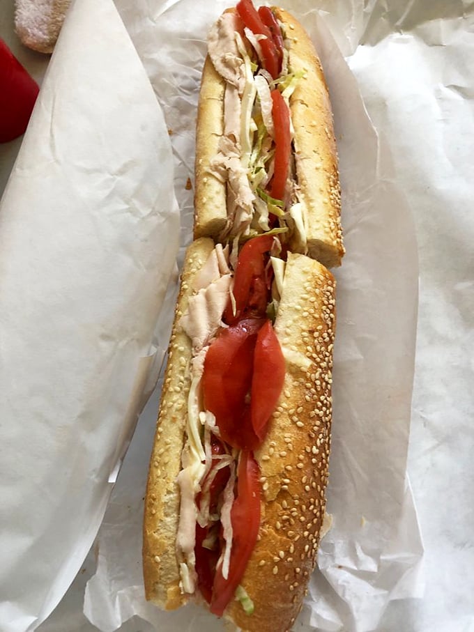 This turkey hoagie isn't just lunch; it's a masterclass in balance. Crisp vegetables, tender meat, and that roll – oh, that perfect roll.