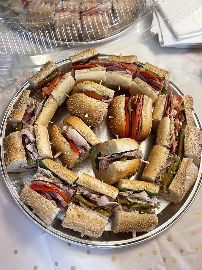 A platter of sandwich perfection&mdash;each segment a miniature masterpiece of meat, cheese, and vegetables arranged with mathematical precision that would impress Einstein.