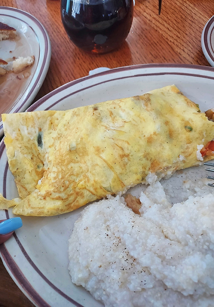The Ultimate Omelet lives up to its ambitious name—a fluffy egg envelope stuffed with enough fillings to make breakfast a daylong memory.