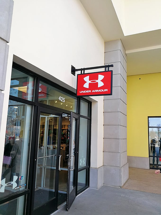 Under Armour: where weekend warriors and actual athletes shop side-by-side, united by the universal language of moisture-wicking technology. 
