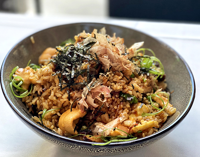 Unagi fried rice with bonito flakes dancing on top - because who says steakhouses can't master the art of fusion?