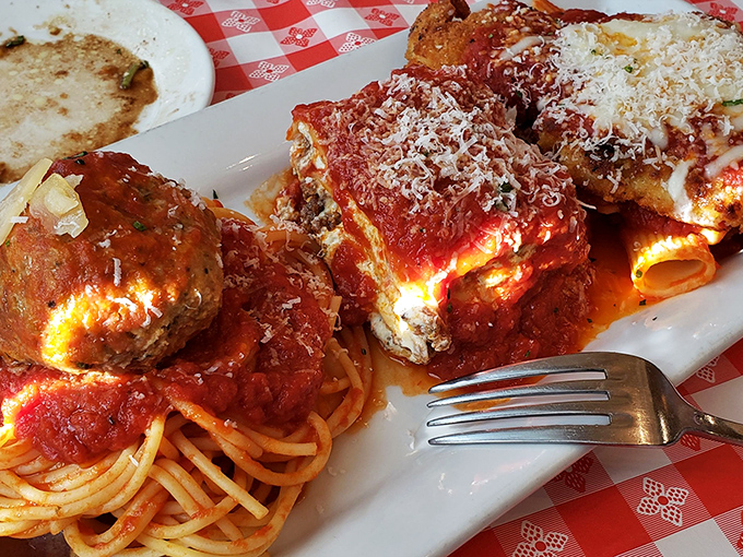 The legendary veal parmigiana with its perfect meatball sidekick. That sauce isn't just red&mdash;it's a sunset over Tuscany on a plate.