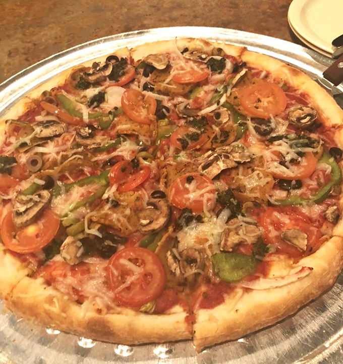 A symphony of fresh vegetables dancing atop a perfect crust. This veggie-loaded masterpiece proves pizza paradise isn't just for carnivores.