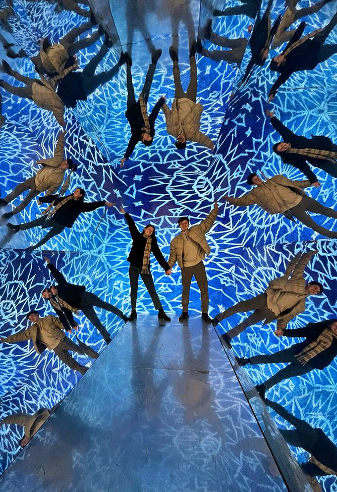 The Infinity Room transforms visitors into infinite reflections, creating a galaxy of human stars. Selfie heaven meets existential wonder.