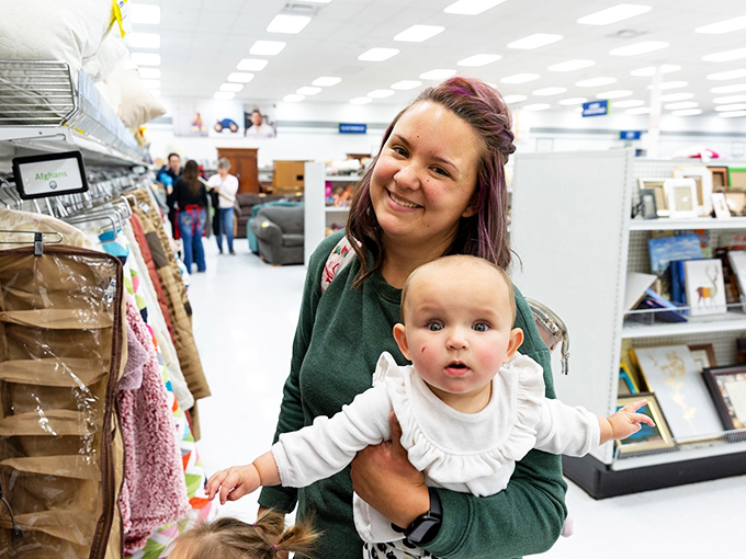 The store welcomes shoppers of all ages, where family thrifting traditions are passed down alongside gently used baby clothes and vintage finds.