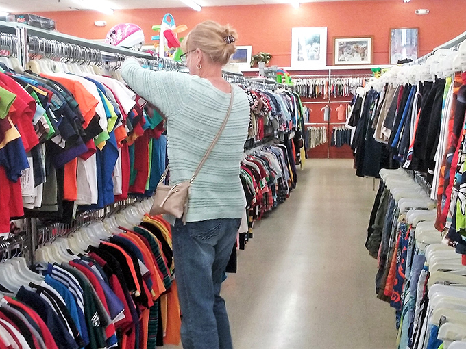 One woman's focused hunt through the racks – she knows something good is hiding in there.