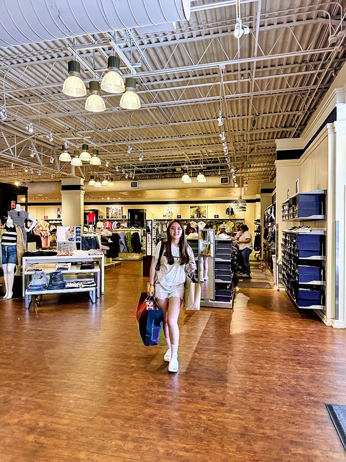 Retail therapy in progress. The wooden floors and bright lighting create the perfect backdrop for the "I just saved so much money" victory strut.