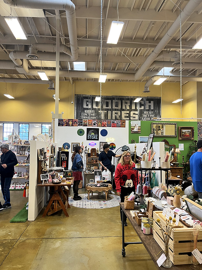 Beneath industrial ceilings and a vintage Goodrich Tires sign, shoppers navigate a wonderland of curated booths, each with its own personality.