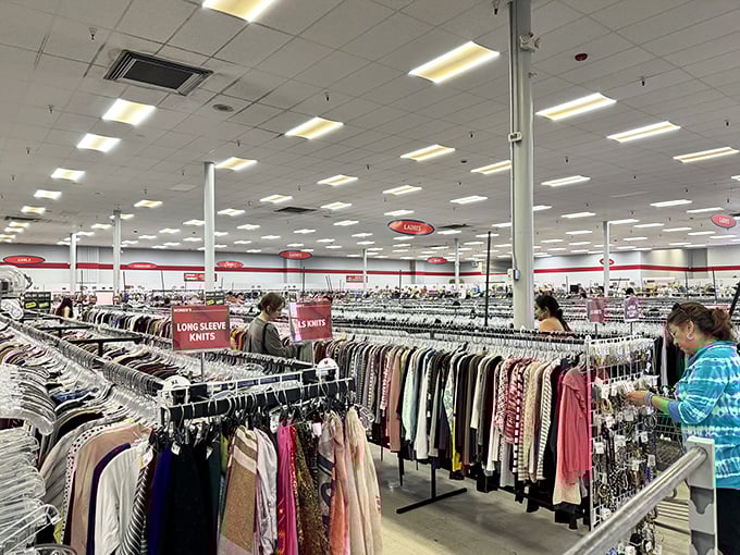 Serious thrifters navigate the clothing forest with practiced precision, their carts like trusty sidekicks on this treasure-hunting expedition.