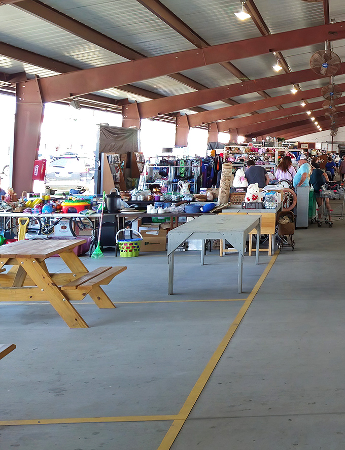 Tables stretch toward the horizon in this wonderland of wares, where shoppers navigate aisles like explorers charting unknown territories.