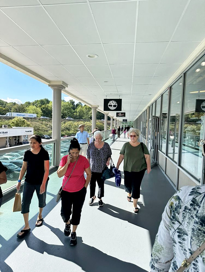 The covered walkways of Pocono Premium Outlets offer shoppers protection from the elements and a runway for showcasing their latest finds.