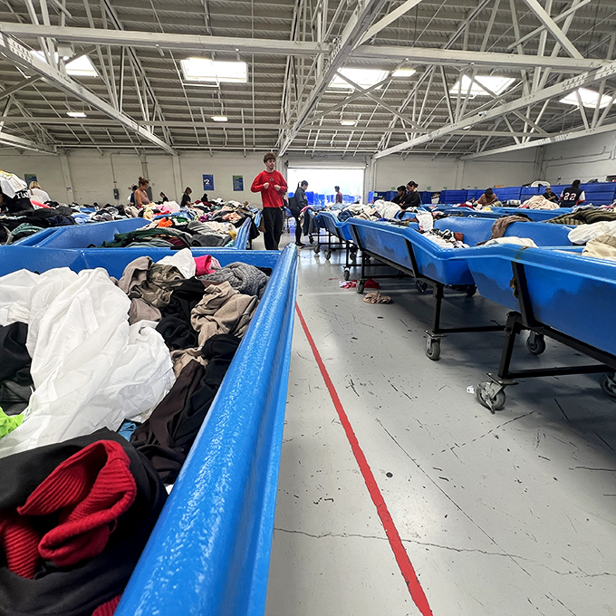 Treasure hunters in their natural habitat. Notice the focused expressions &ndash; they've spotted something promising three bins ahead.
