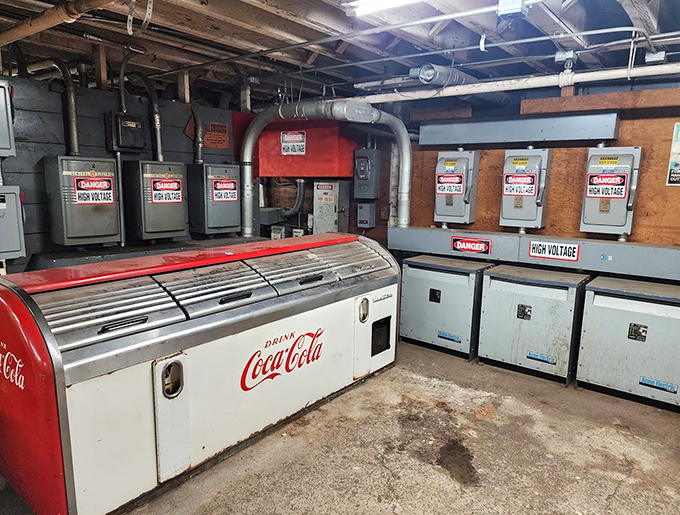 The electrical heart of bygone factories meets vintage Coca-Cola cooling technology&mdash;industrial archaeology at its most fascinating.