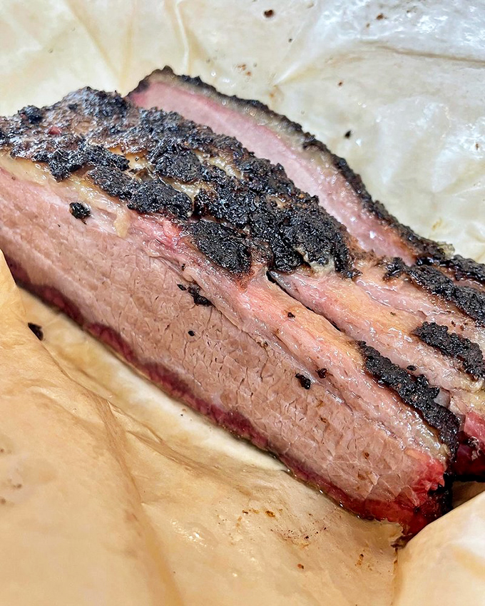 American Wagyu brisket with a smoke ring so perfect it belongs in a barbecue museum's hall of fame.
