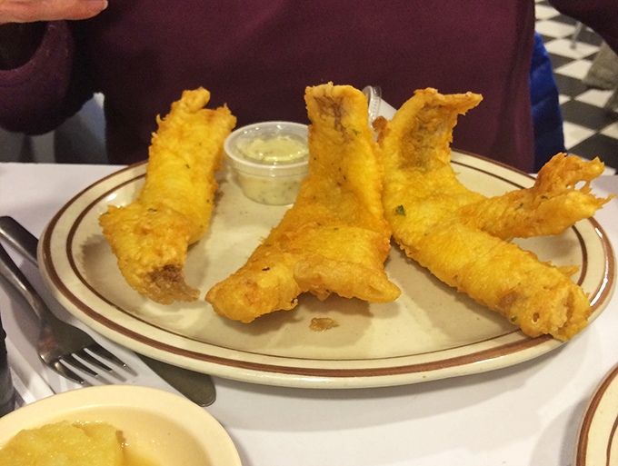 Golden-battered walleye stands at attention, ready to dive into the pool of tartar sauce&mdash;Friday's all-you-can-eat special that locals plan their week around.