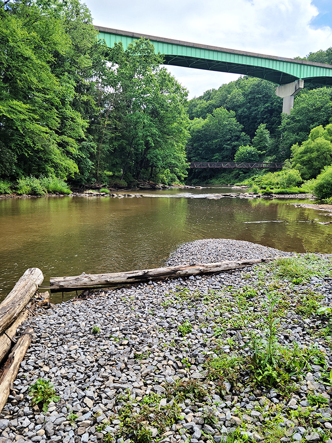The bridge spanning the river creates a perfect frame for nature's artwork &ndash; the kind of view that makes you forget to check your phone.