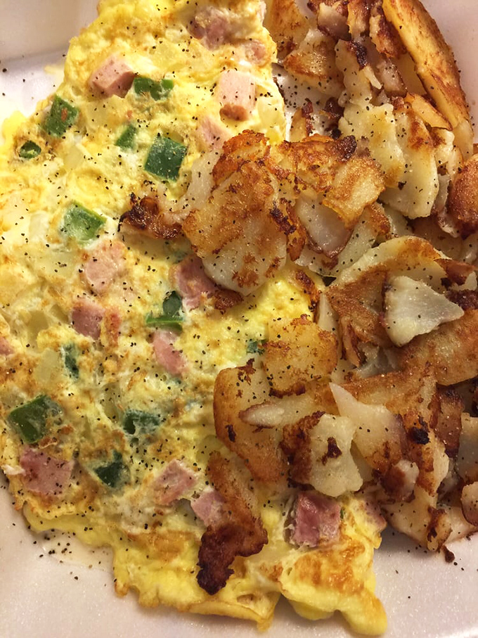 Western omelets should come with a passport. This one's fluffy enough to sleep on, with home fries that deserve their own zip code.