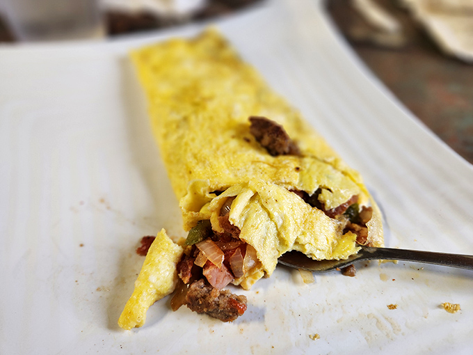 This Western omelette isn't trying to reinvent breakfast - it's just executing it perfectly, with generous fillings and golden edges.